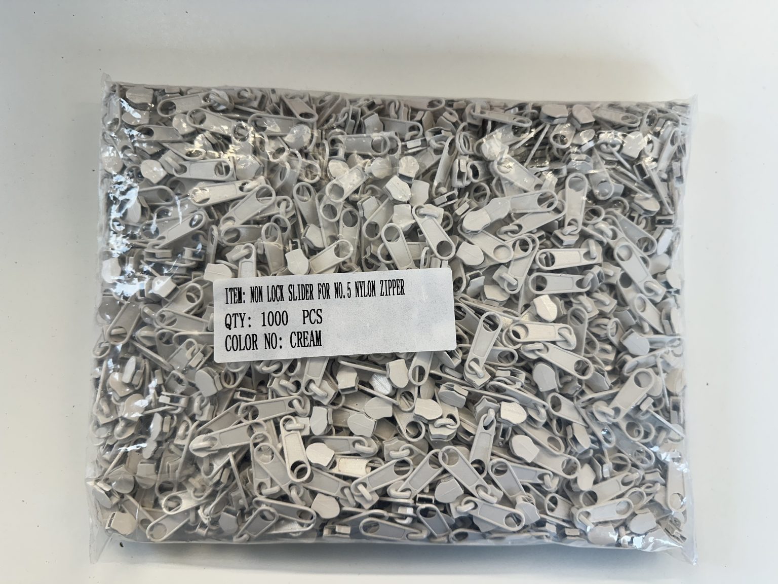 Clearance Cream No5 Zip sliders Bag of 1000 - Livedale Foam & Sundries Ltd